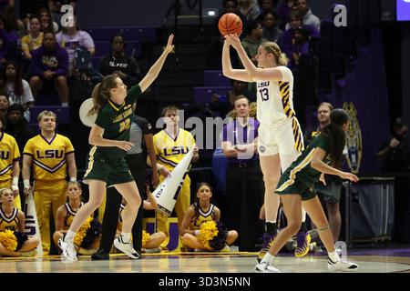 LSU Tigers forward Kate Koval (13) blocks Tulane Green Wave guard Jayda ...