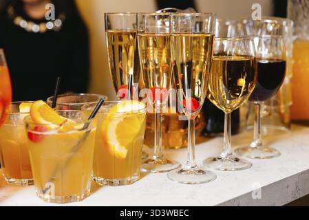 A selection of alcoholic beverages including champagne, wine, and ...