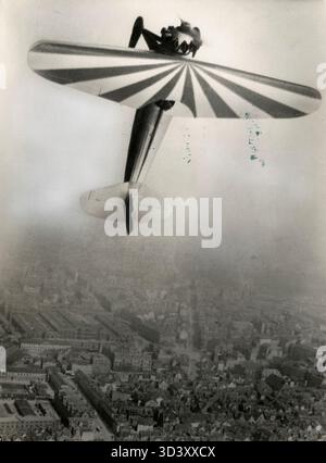 A stunt plane begins its looping maneuver, preparing for a full aerial ...