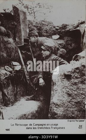 A soldier using a periscope in the trenches during World War One to ...