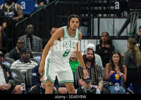 Boston Celtics forward Josh Minott, right, looks down court while ...