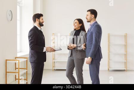 Real estate agent presenting property investment opportunity in office ...