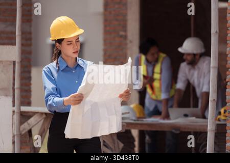 Portrait of engineers work together to assess the residential home ...