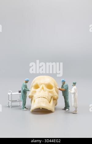 Medicine and healthcare concept. A human figurine pushes a blue wooden ...