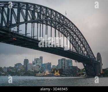 Sydney harbour bridge with views across the harbour to Sydney skyline ...