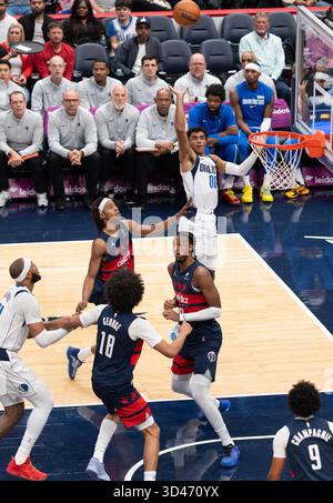 Dallas Mavericks guard Max Christie warms up before an NBA basketball ...