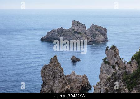Skeludi islet seen from shore in Palaiokastritsa famous resort town on ...