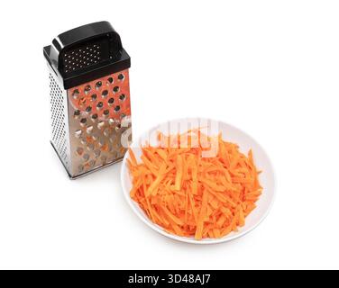 metal grater and fresh carrots closeup on cutting board Stock Photo - Alamy