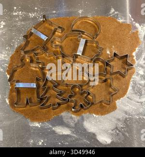 Gingerbread cookie dough and christmas cookie cutters. Baking holiday ...