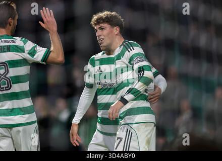Celtic's Arne Engels (right) celebrates scoring his sides second goal ...