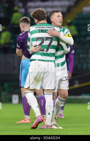 Celtic's Arne Engels (right) celebrates scoring his sides second goal ...