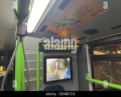 TFL bus cctv information screen on a 13 red bus route in Park Lane ...