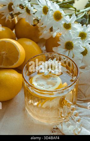 Cup of fresh lemons on light background Stock Photo - Alamy
