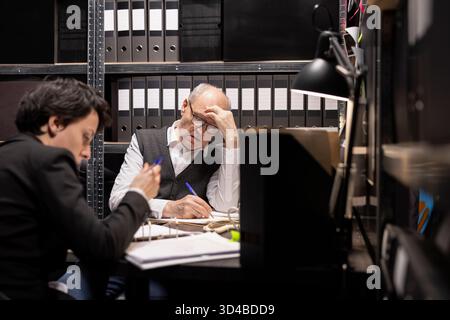 Frustrated overwhelmed woman investigator interpreting evidence in ...