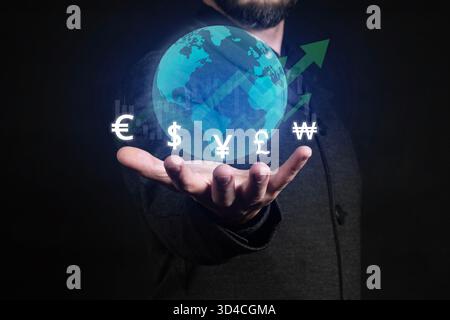 Businessman holding currency symbols concept Stock Photo - Alamy
