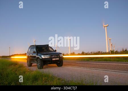 Front view of a modified yellow Land Rover Discovery Series II on a ...