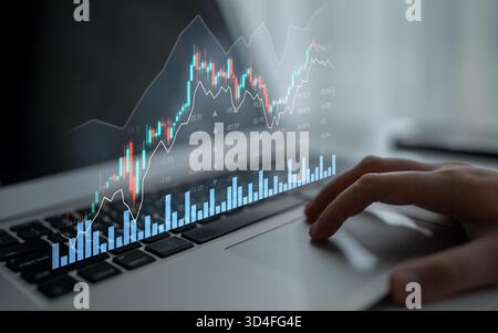 A screen displays stock market trends in Shanghai, China, 2 February ...