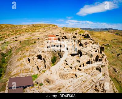 Uplistsikhe aerial panoramic view. Uplistsikhe is an ancient rock hewn ...