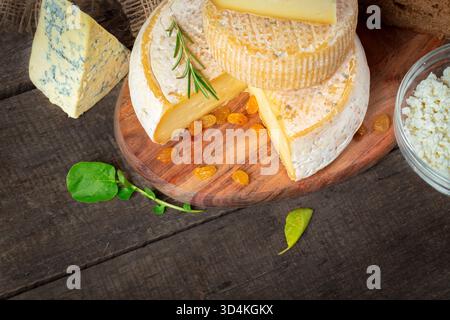 Elegant Display of Various Cheese Types and Gourmet Jelly on a Wooden ...