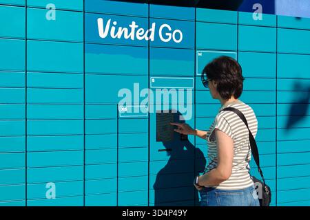 Finestrat, Spain- 10 November 2025: Woman using Vinted go locker ...