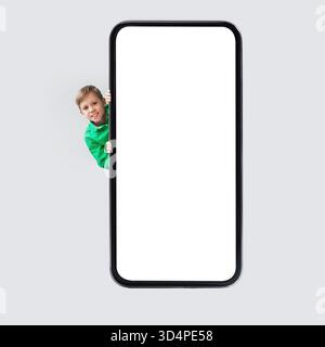 Smiling cheerful positive preteen boy looking for fresh delicious ...