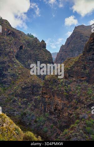 Layered volcanic rock formations with visible bands of tuff and basalt ...