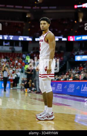 Wisconsin guard Nick Boyd, center, claps his hands while on defense ...