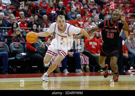 Wisconsin guard Andrew Rohde (7) drives past Providence guard Jason ...