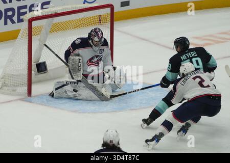 Seattle Kraken center Ben Meyers (59) looks to pass around New York ...