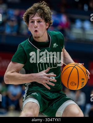 Ohio guard Jackson Paveletzke (13) attempts to fight his way inside ...