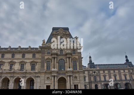 The facade of the Louvre Museum commands attention with its classical ...