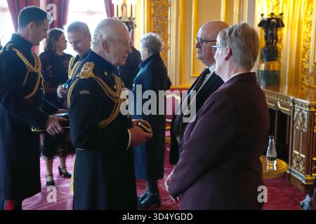 Mr. Eamonn McNulty (Brother) receives the Elizabeth Emblem from King ...