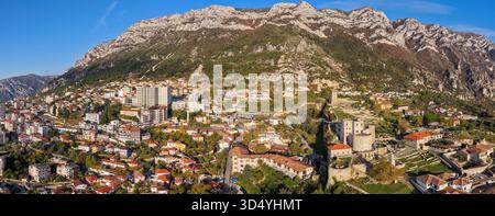 Wide aerial panorama of Krujë city with its historic castle, modern ...