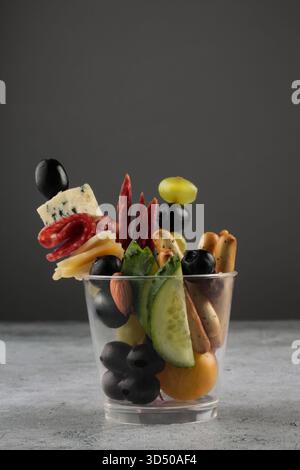 Classic Mediterranean appetizer with savory cured ham, sweet yellow ...