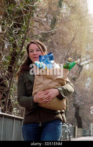 handing over a paper bag for transporting goods at the market paper bag ...