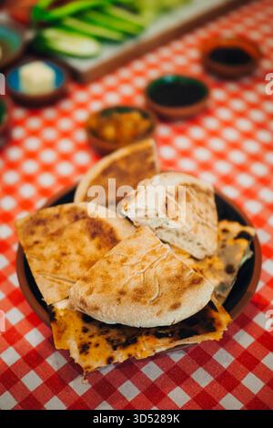 Slices of freshly baked Turkish bread with assorted sweet pastries ...