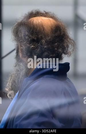 Taleb al-Abdulmohsen sits in a glass box during the trial at the ...