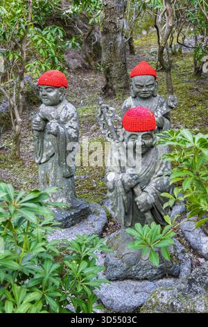 Buddha with red caps at Buddha temple Takifudo island Miyajima ...