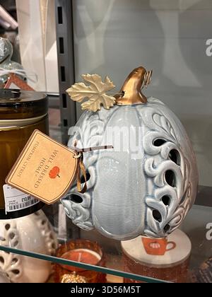 Autumn decor with ceramic decorative pumpkin. Fall leaves arrangement ...