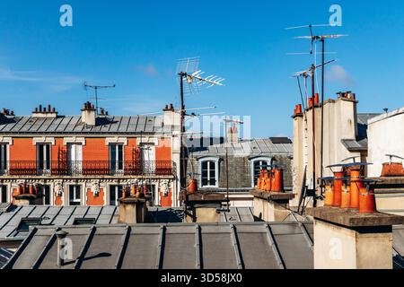 Classic Paris rooftops with chimneys and mansard windows Stock Photo ...