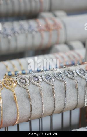 Gold jewelry is displayed at a gold store in Hangzhou, east China's ...