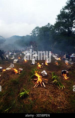 Families light bonfires at the grave of their ancestors at the night of ...