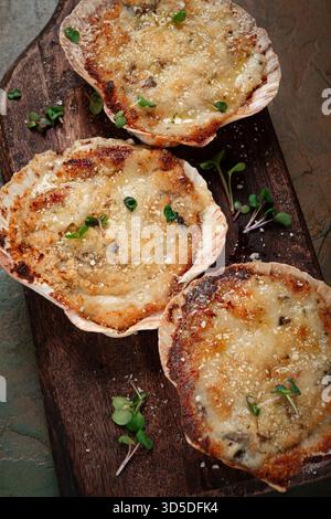 Luxury baked scallops with cheese and garlic Stock Photo - Alamy