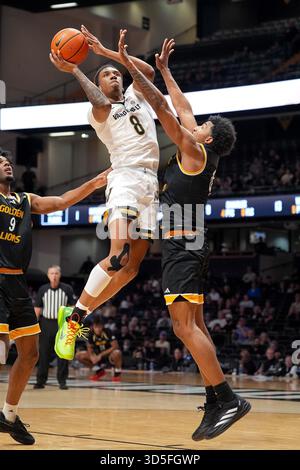 Vanderbilt guard Tyler Harris (8) shoots the ball past New Haven ...