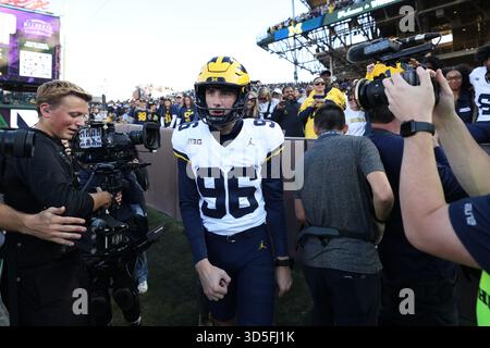 Michigan kicker Dominic Zvada (96), with punter Hudson Hollenbeck (90 ...