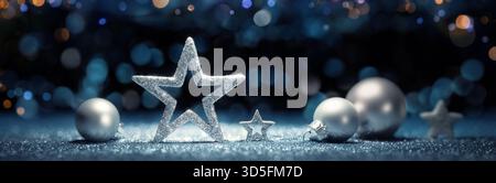 Sparkling silver glitter on blue background. Holiday blurred lights ...