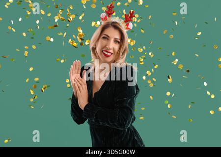 Beautiful Christmas headband and confetti on light background with ...