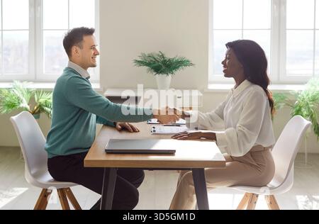 After successful interview. Black female job seeker talking on ...