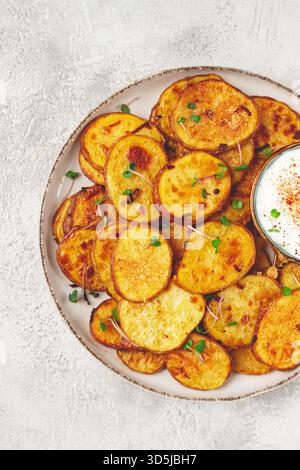 Crispy potato slices, with parmesan cheese and spices, fried in the ...