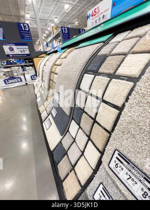 Retail carpet swatches in curved display Stock Photo - Alamy
